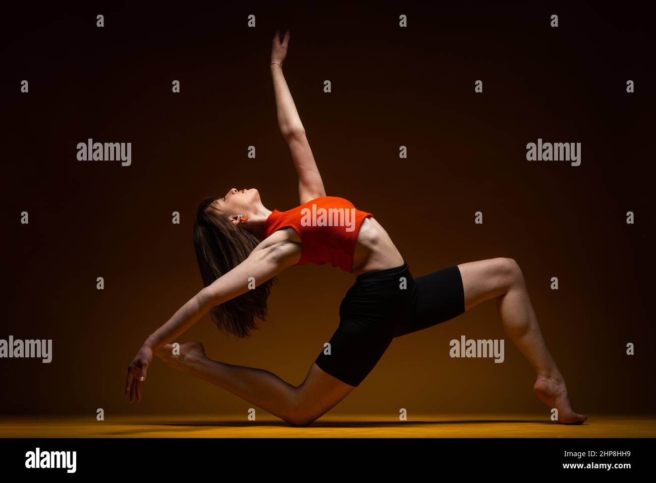 Ballerina is doing a great balance pose on the ground Stock Photo - Alamy