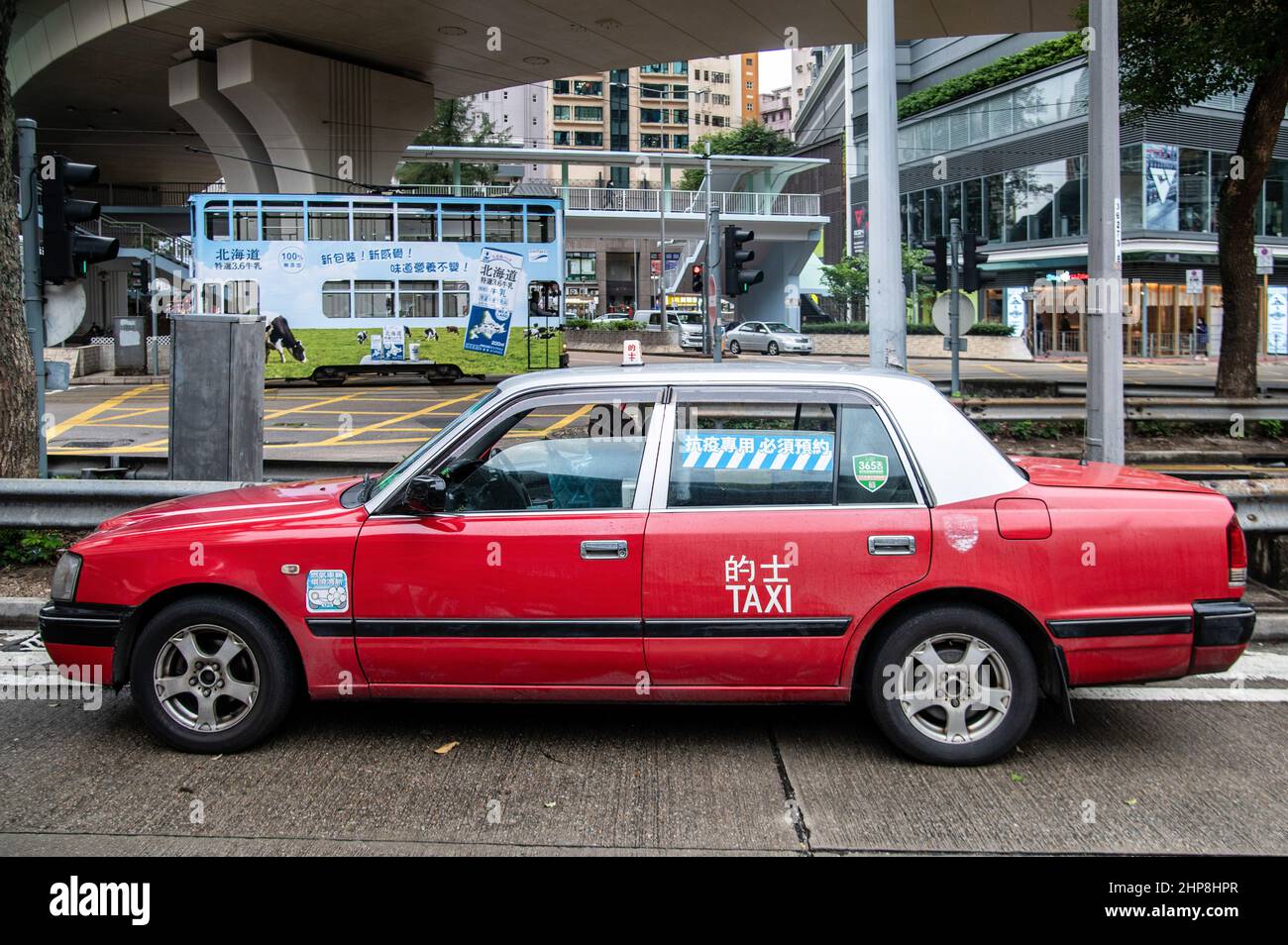 A taxi exclusivley for COVID-19 patients awaits its next passenger. A ...