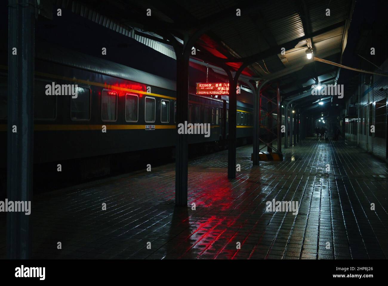 A train station platform at night Stock Photo - Alamy