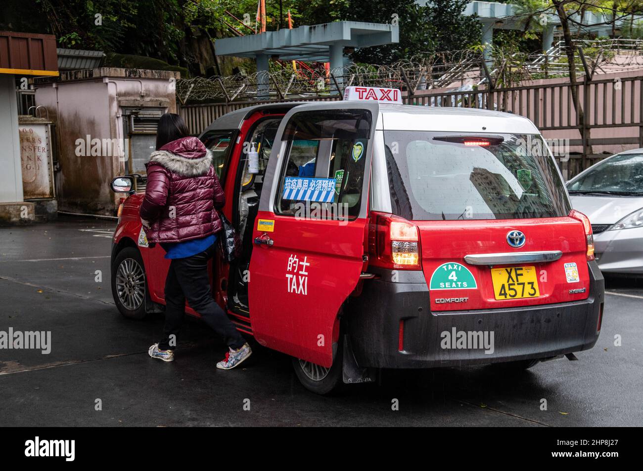A passenger is picked up by taxi at designated COVID-19 clinic in Shau ...
