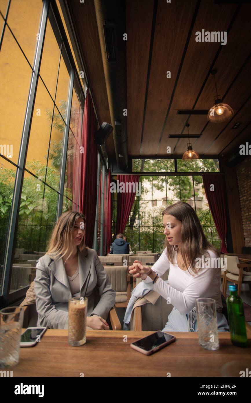 Two amazing and beautiful sisters are talking about something serious ...