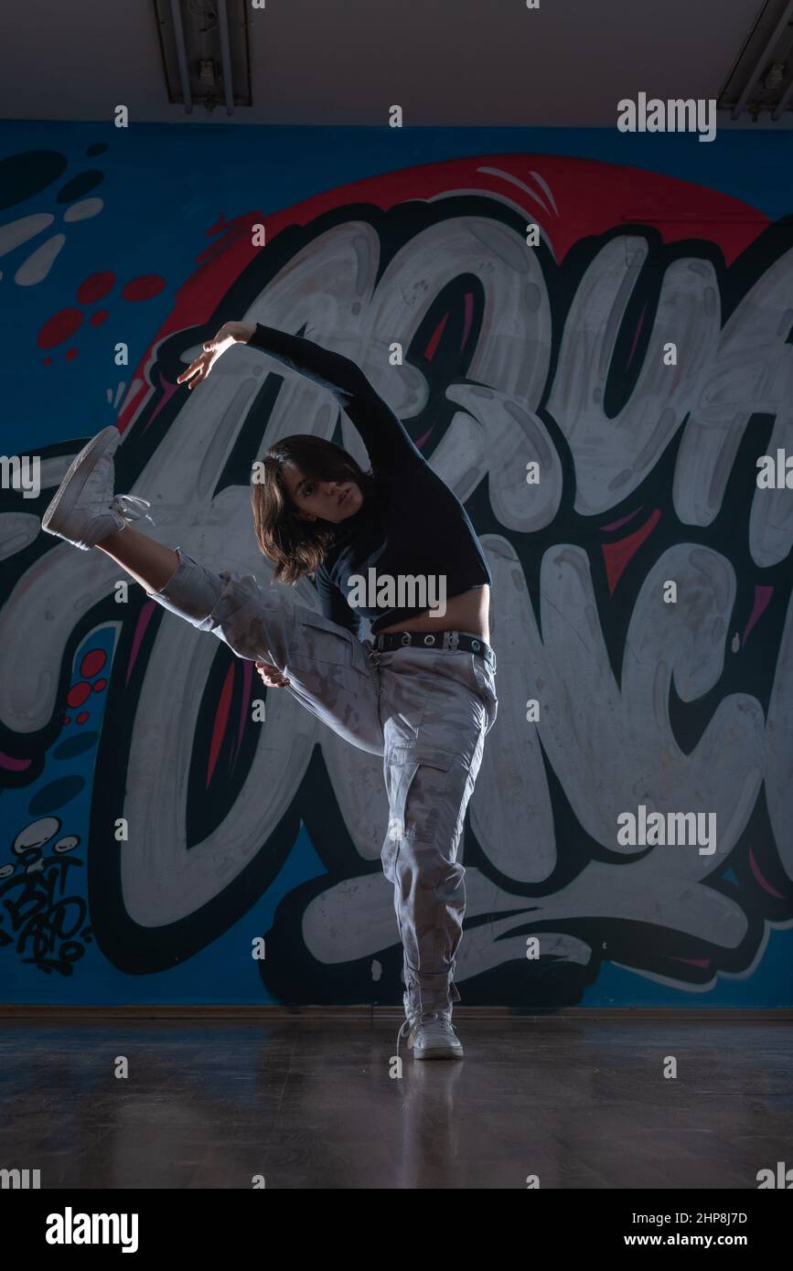 Silhouette of young woman hiphop dancer (breakdancer)dancing on ...