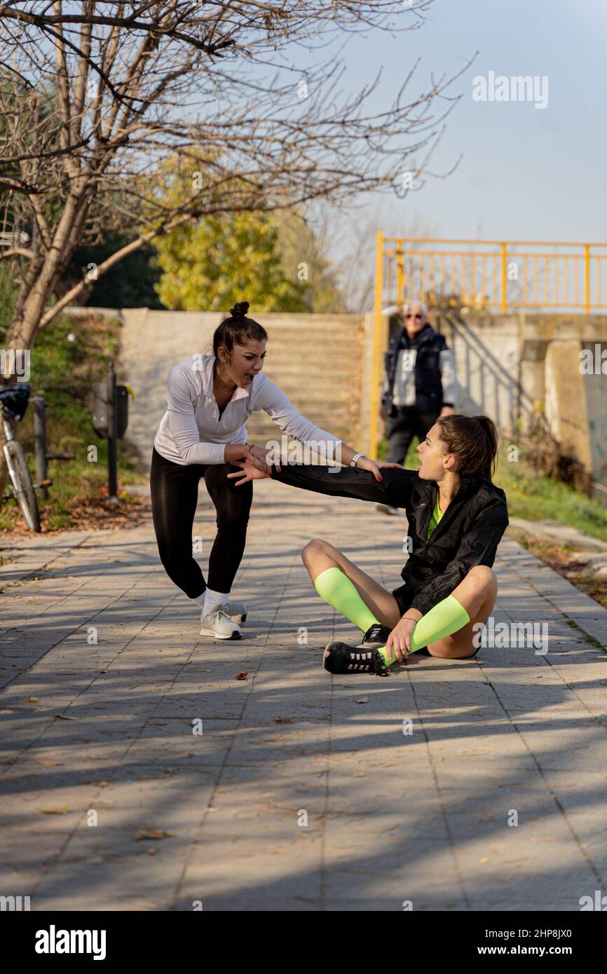 Attractive fit girl is running to help her friend while injuring ...