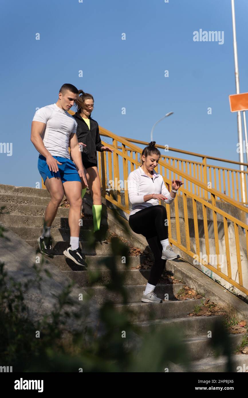 Three attractive and amazing fit friends are exercising Stock Photo - Alamy