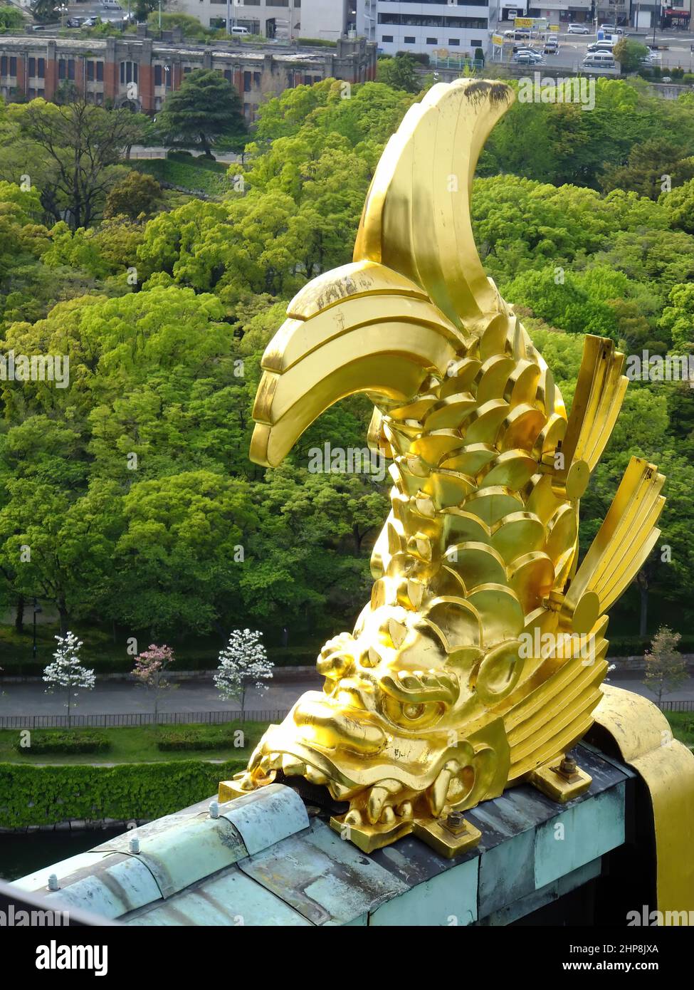 Close up shot of the gold fish status of the famous Osaka castle at ...