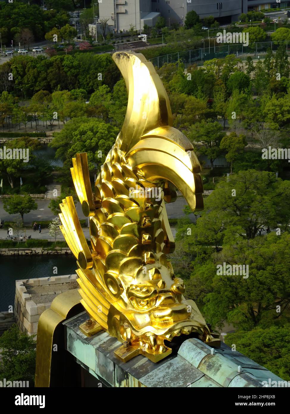 Close up shot of the gold fish status of the famous Osaka castle at ...
