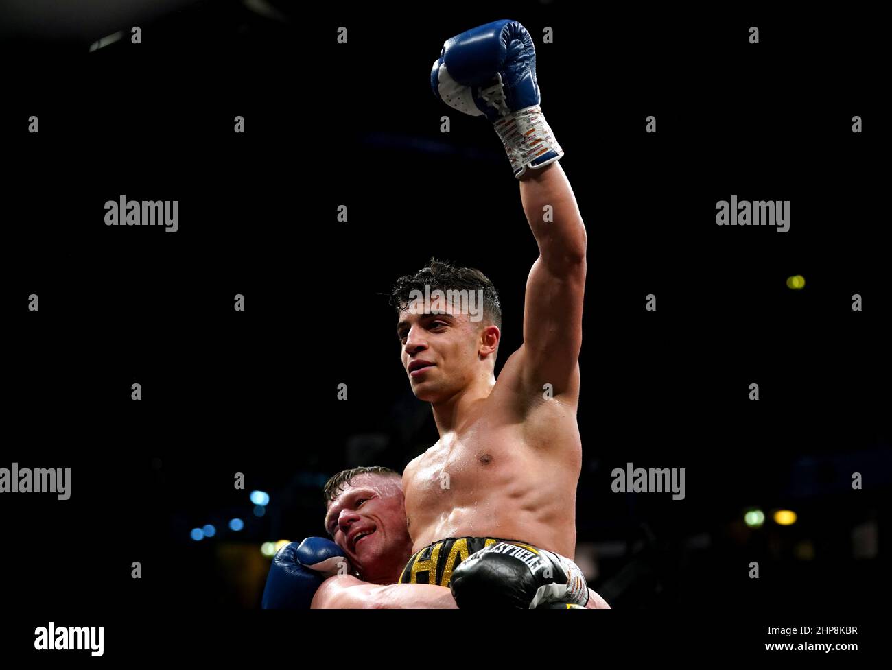 Abdul Khan is picked up by Ricky Starkey after winning their ...