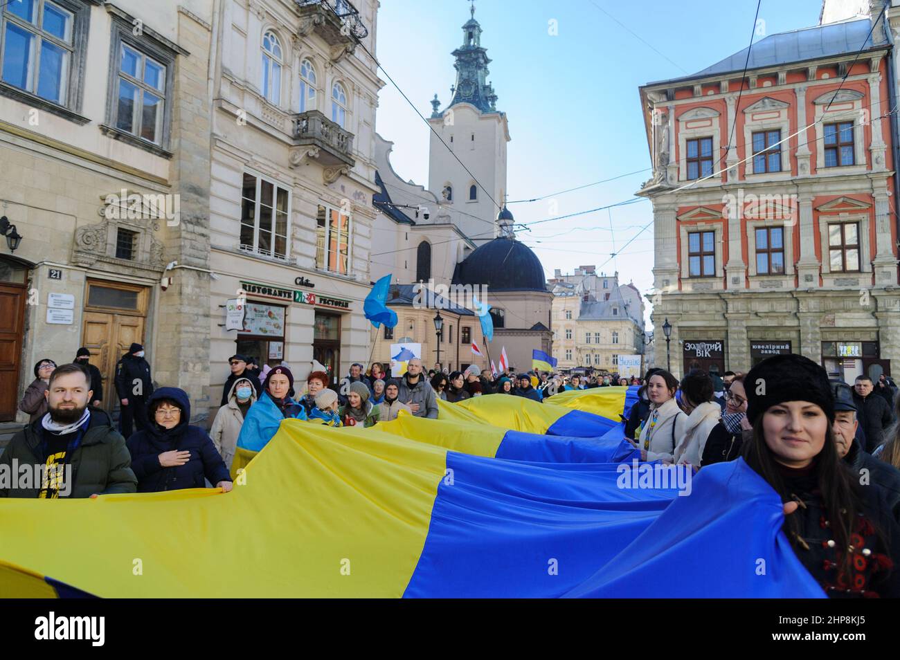 Ukrainians seen holding a Ukrainian flag during the Unity march on the ...