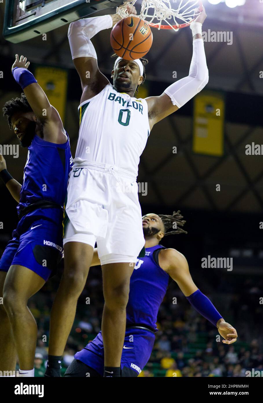 February 19 2022: Baylor Bears forward Flo Thamba (0) dunks the ball ...