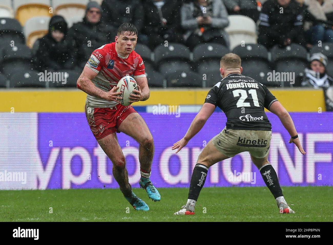 Jack Welsby (1) of St Helens runs at Jordan Johnstone (21) of Hull FC ...