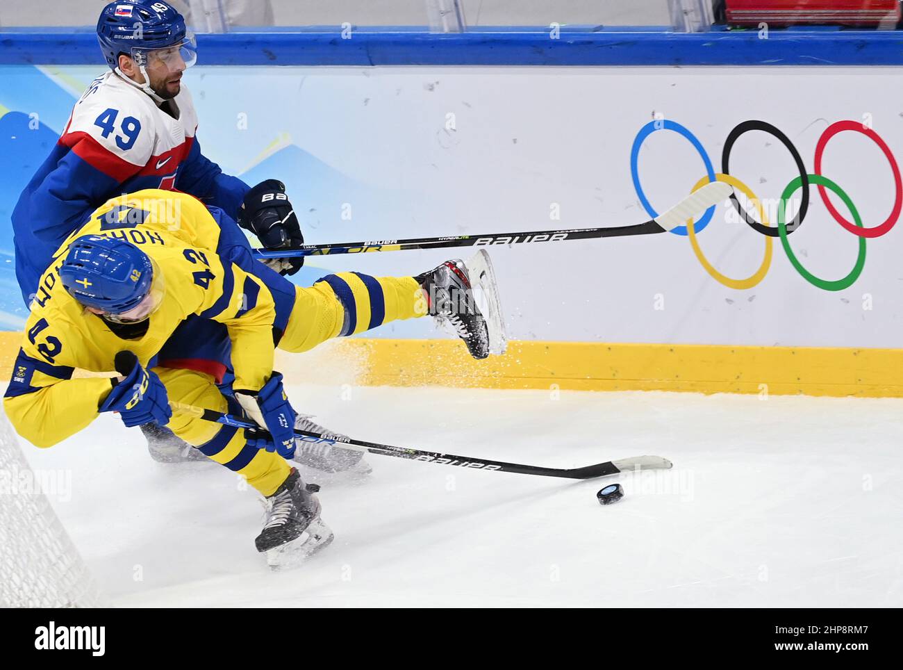 Beijing, China. 19th Feb, 2022. Joakim Nordstrom (front) of Sweden vies ...