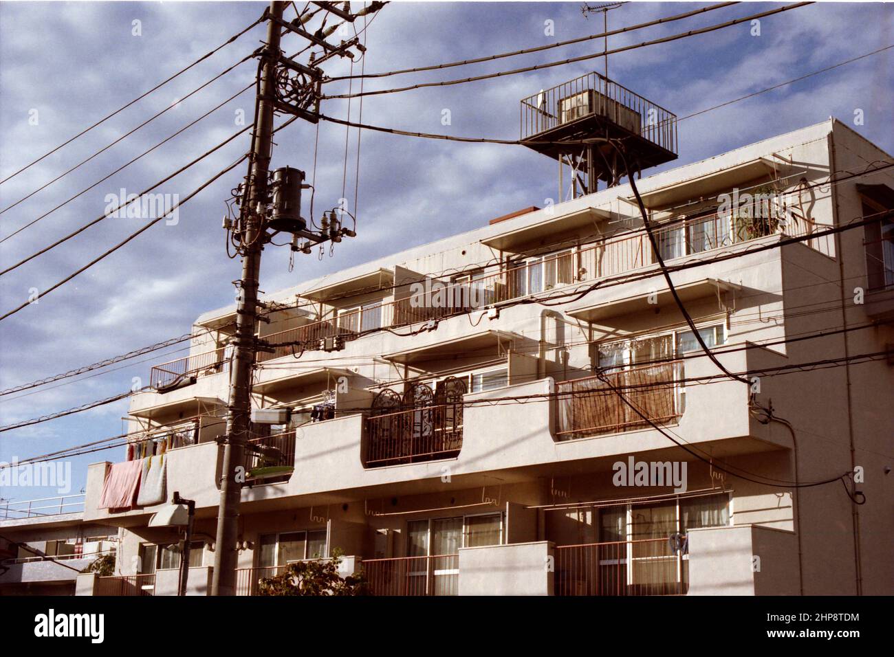 Exterior view of a residential building in Tokyo, Japan on cloudy sky ...