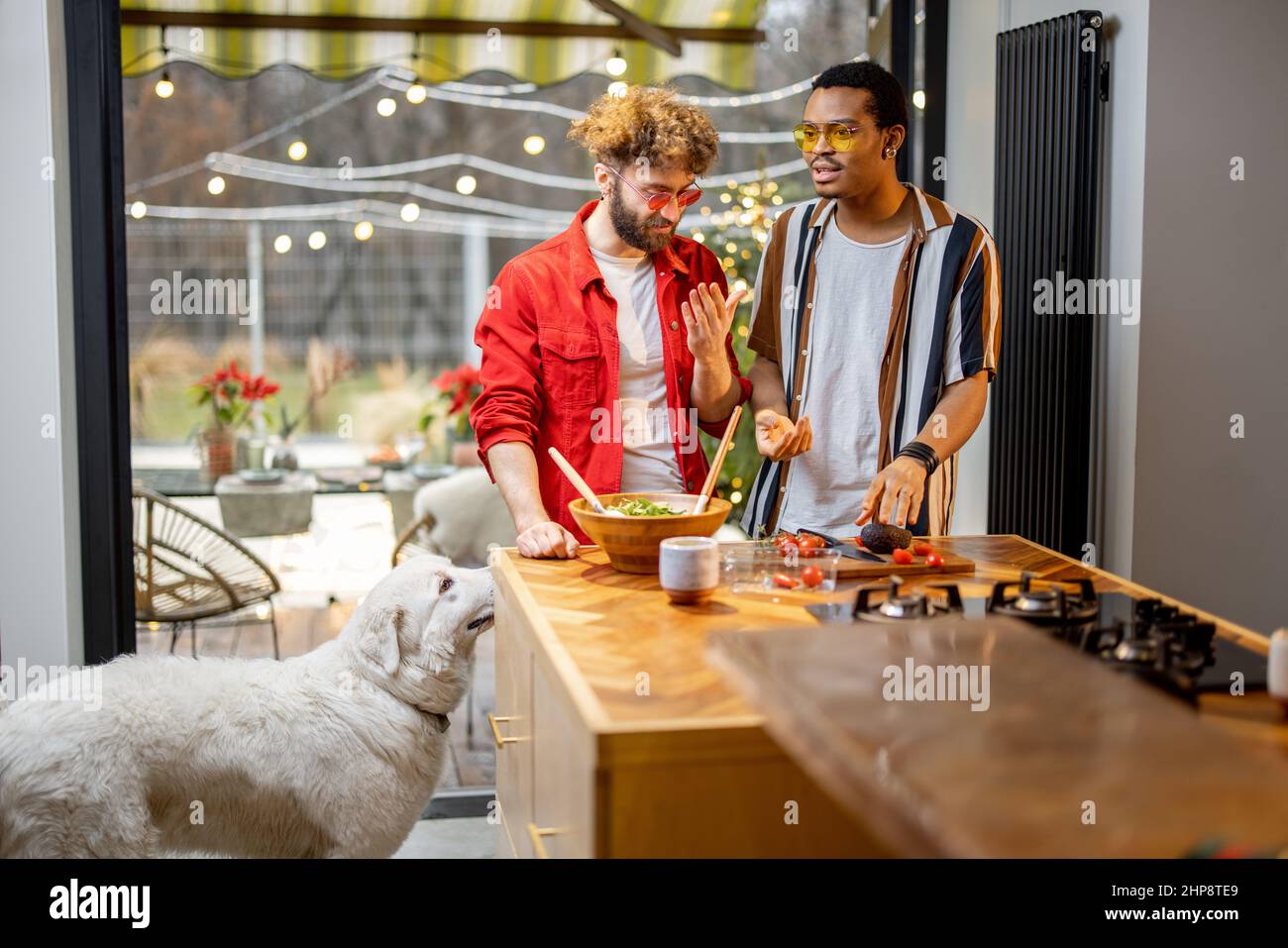 Two guys cooking healthy together at home Stock Photo - Alamy