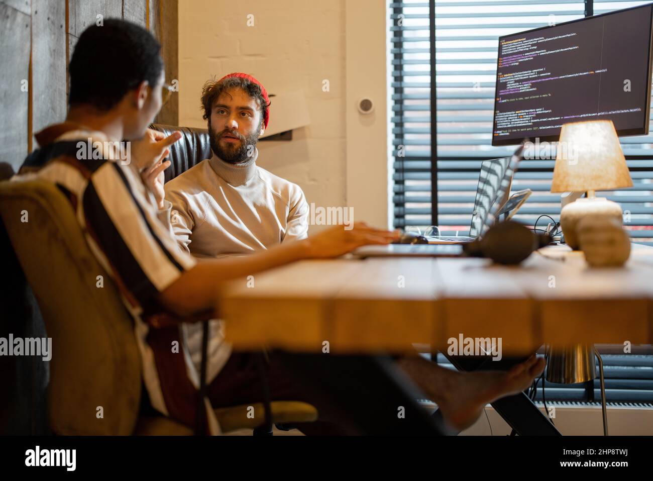 Two men working on computer at home office Stock Photo - Alamy