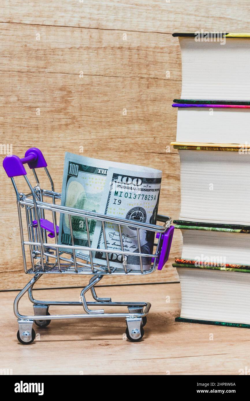 stack of books .Trolley. Concept of book trade, book business ...