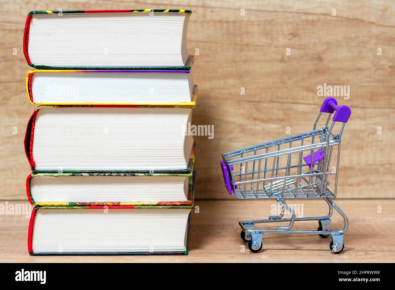 stack of books .Trolley. Concept of book trade, book business ...