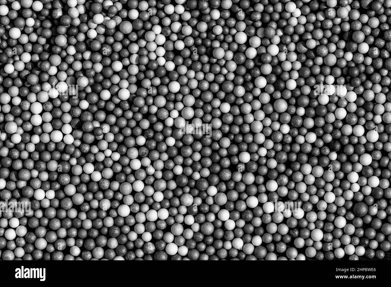 Many different colored small balls Black and White Stock Photos ...