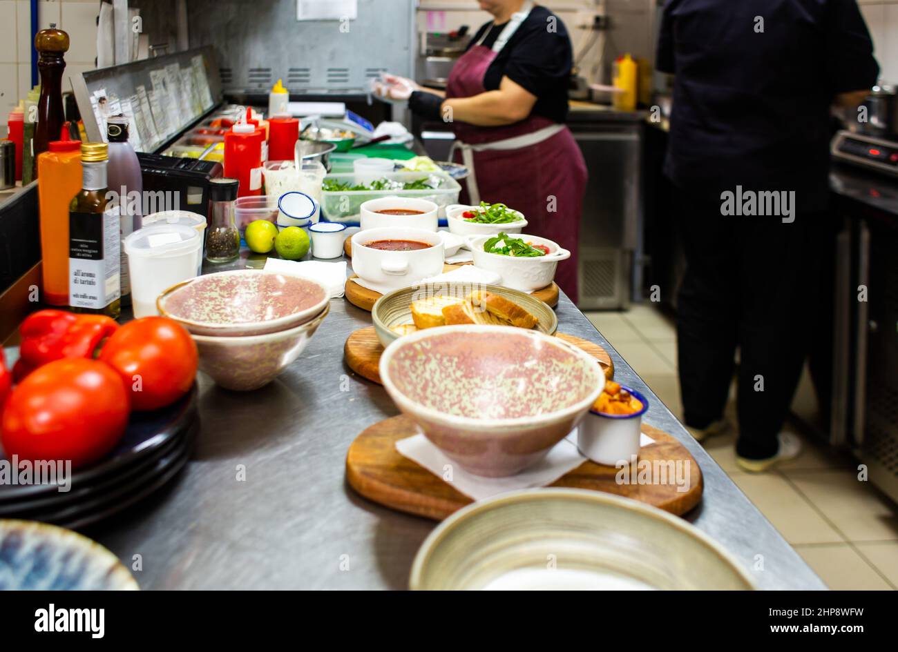 Professional chef cooking in the kitchen restaurant at the hotel ...
