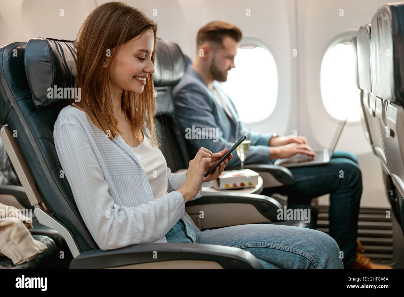 Woman and plane and phone hi-res stock photography and images - Alamy