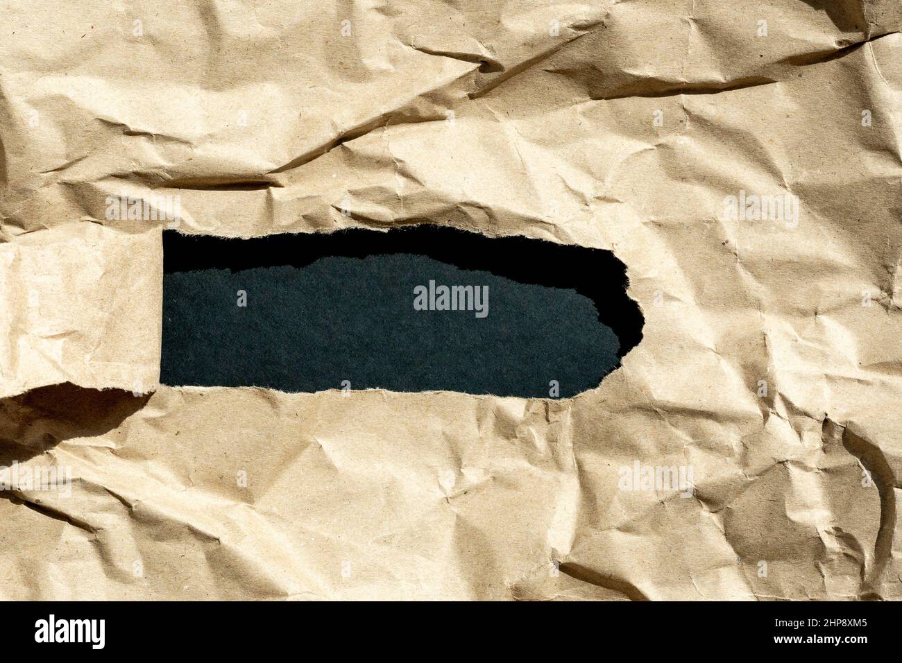 hole in paper with color paper background inside. Good paper texture ...