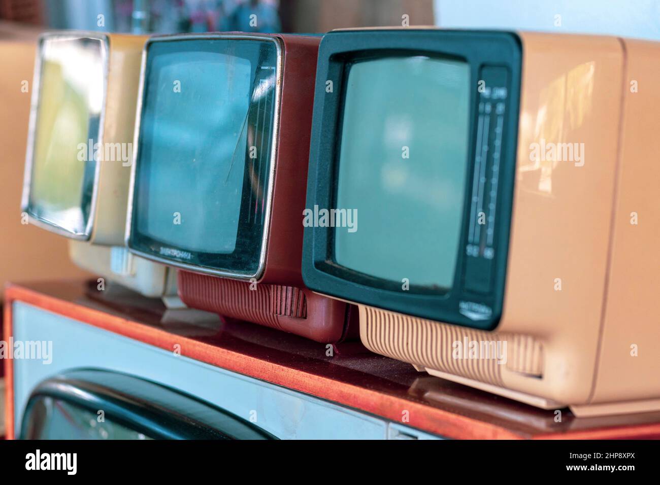 Many retro television. vintage old TV is colorful multi-row. Seeing the ...