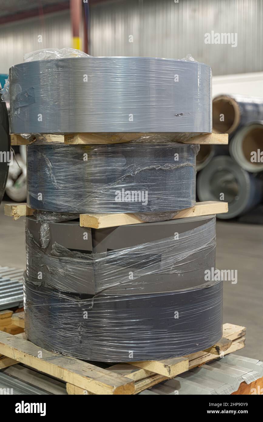 stack of Coil steel metal rolls in metal roofing factory Stock Photo ...