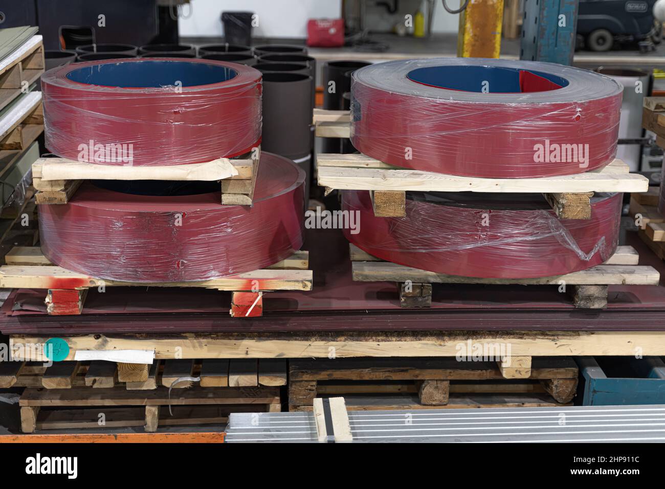 stack of Coil steel metal rolls in metal roofing factory Stock Photo ...