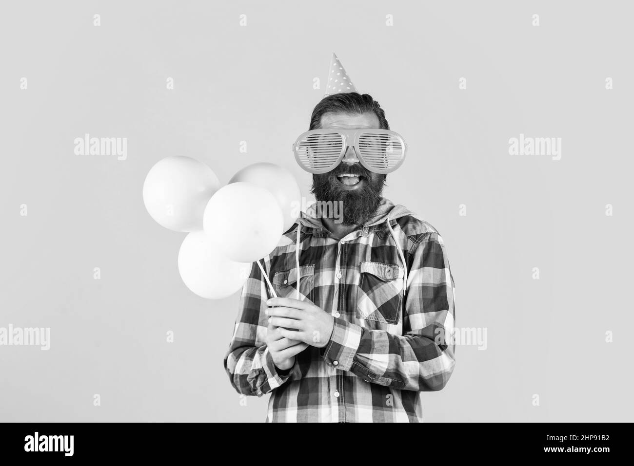 brutal male on party. funny man in birthday hat. happy holiday ...