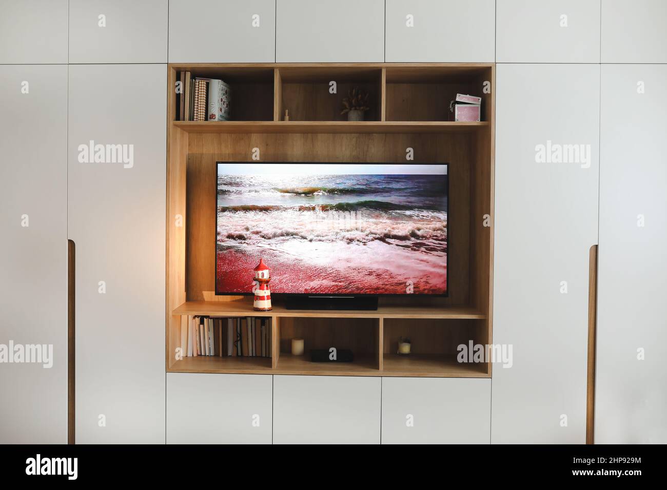 scenic view on TV screen in the living room interior. modern cozy ...