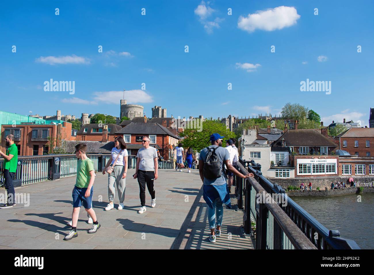 Visitors cross The Eton Walkway, a bridge connecting Eton & Windsor ...