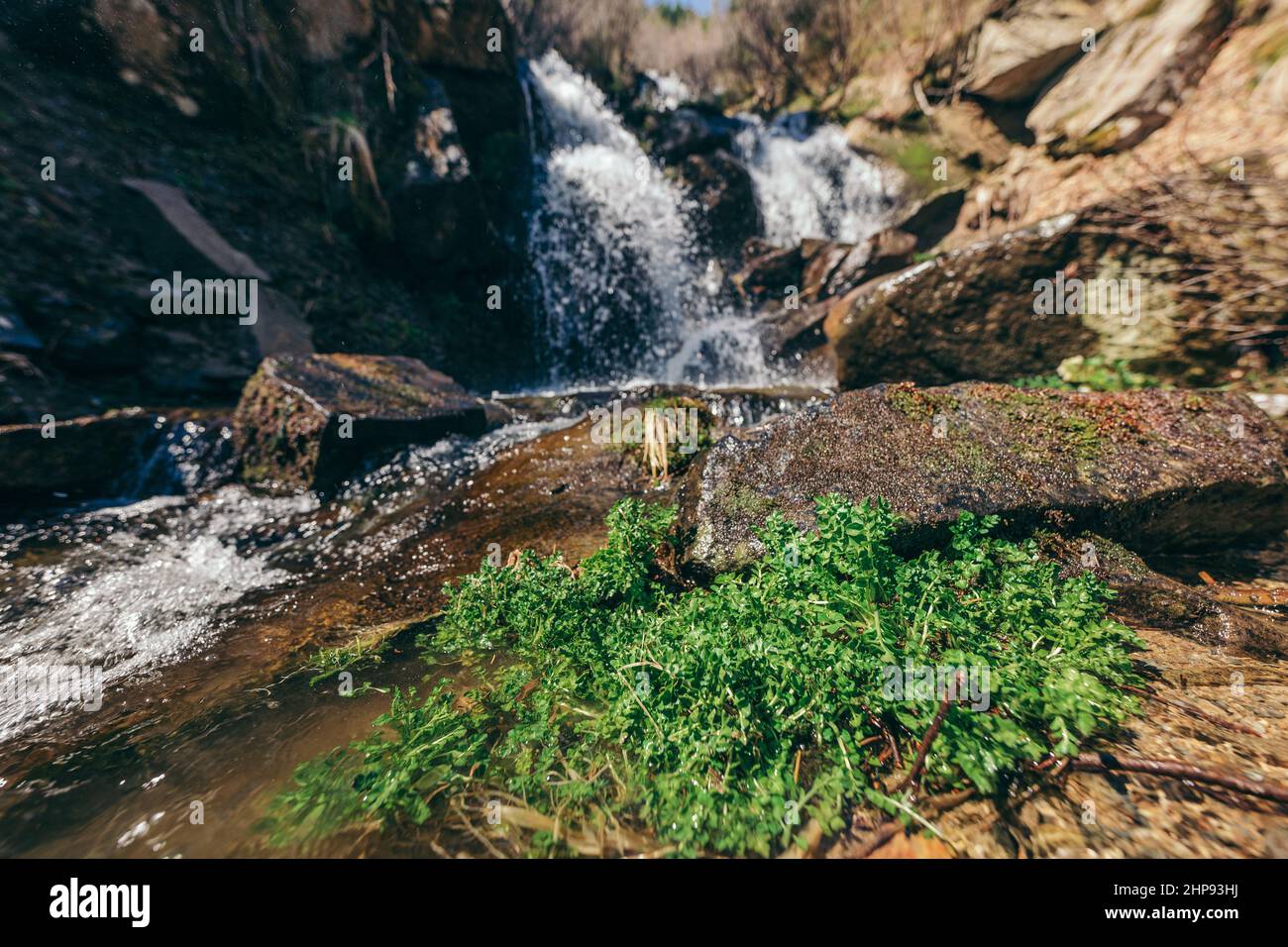 A large waterfall over a rocky cliff Stock Photo - Alamy