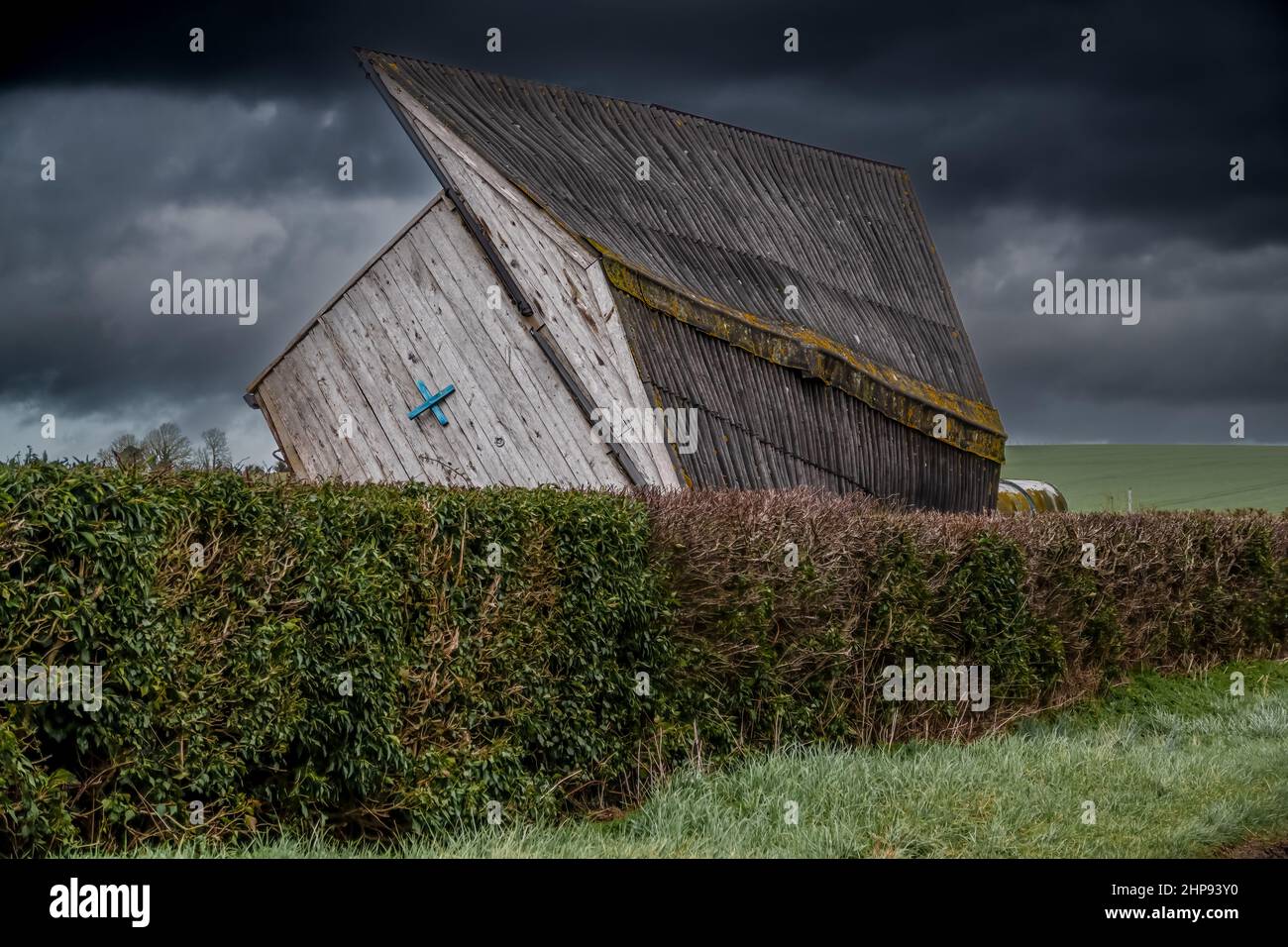 wooden horse stables blown over on to its side strong winds of a storm ...