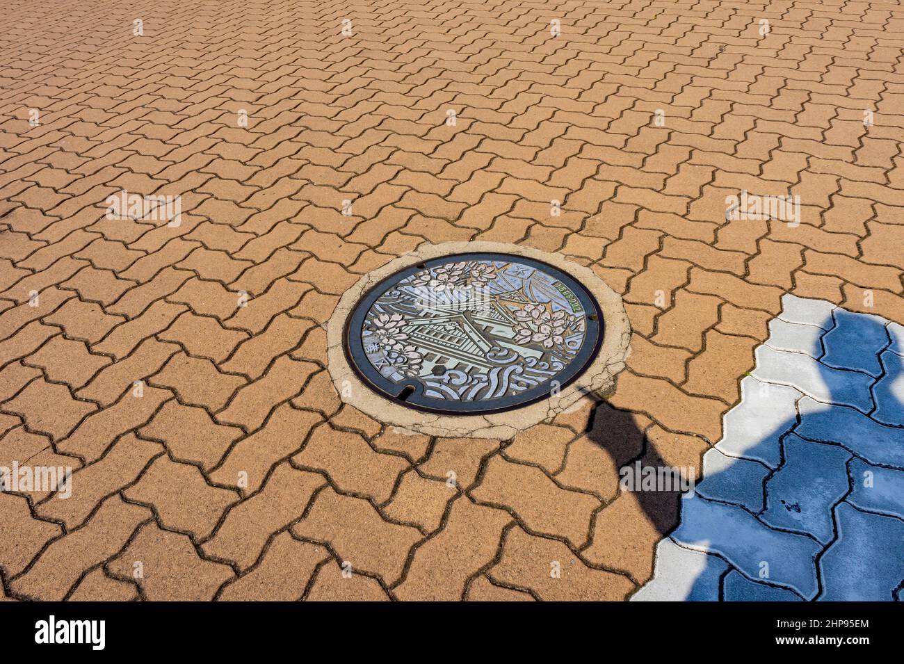 Osaka, APR 29 2011 - Close up shot of a ditch cover with Beautiful ...