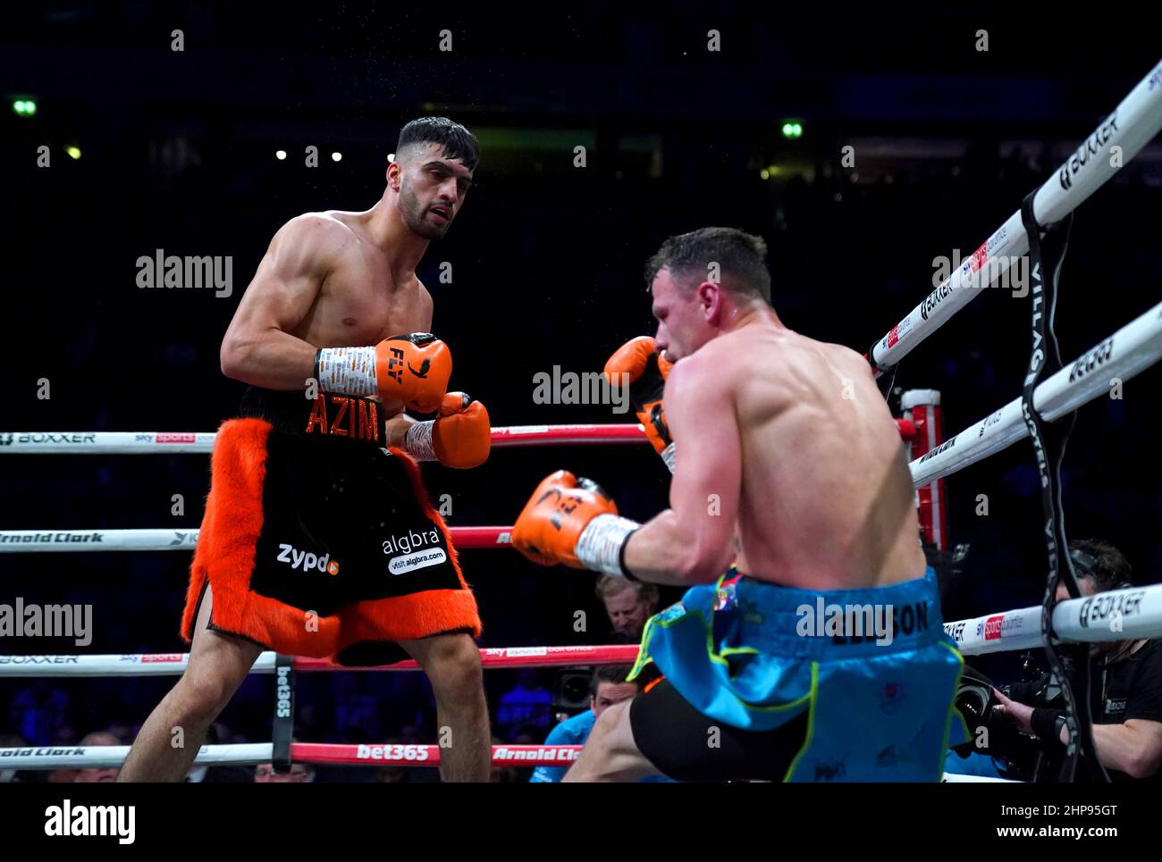 Adam Azim (left) knocks down Jordan Ellison during their Super ...