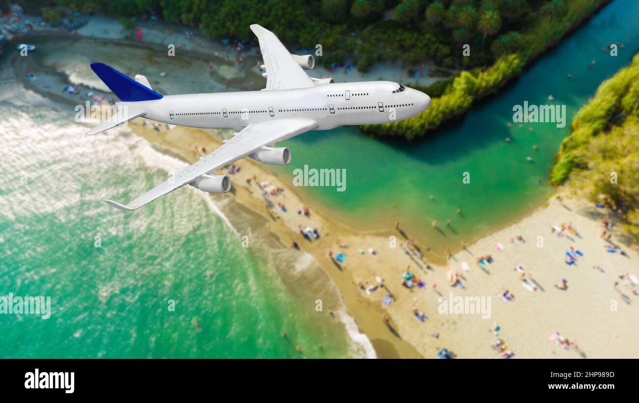 Aerial top down view of an airplane flying over blue sea as a travel ...