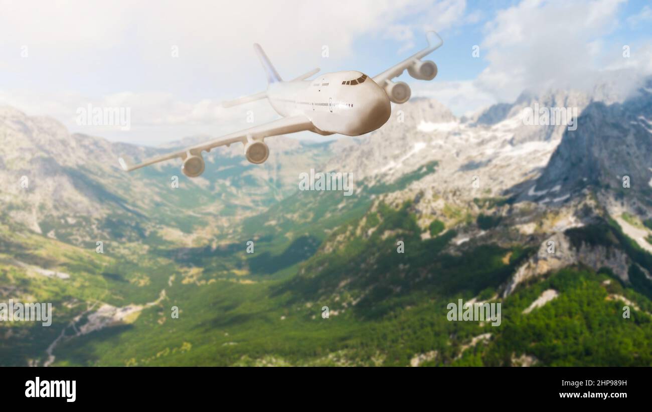 Aerial view of aircraft. Airplane is flying over mountains with forest ...