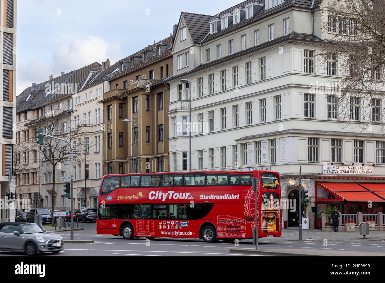 City Tour bus carrying tourists to international landmarks in Cologne ...