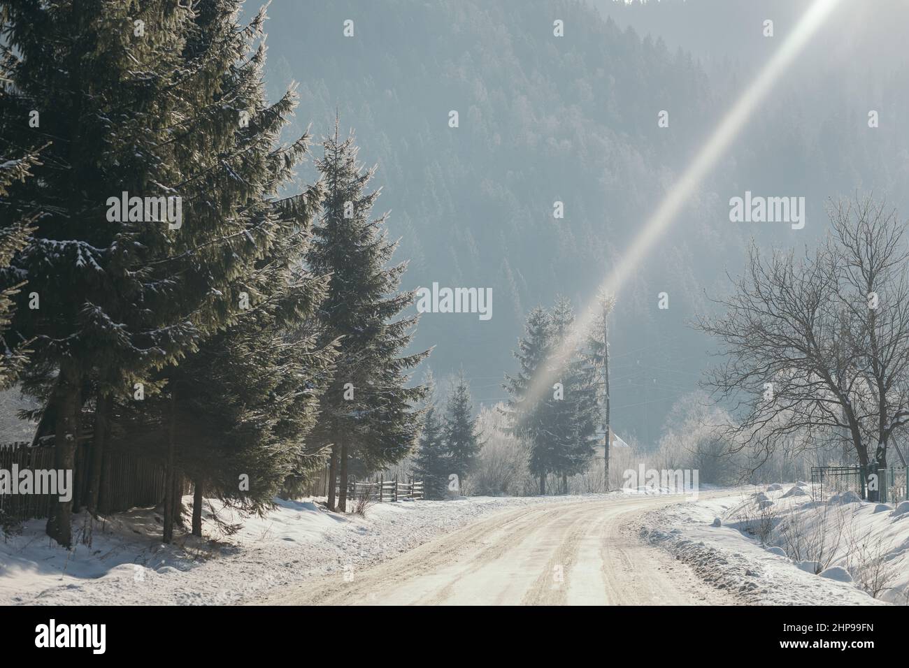 A rainbow over a snow covered slope Stock Photo - Alamy