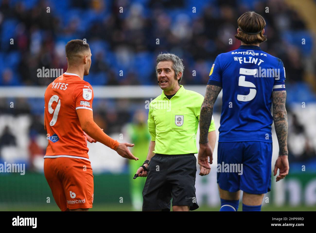 Darren Bond, referee has words with Jerry Yates #9 of Blackpool while ...