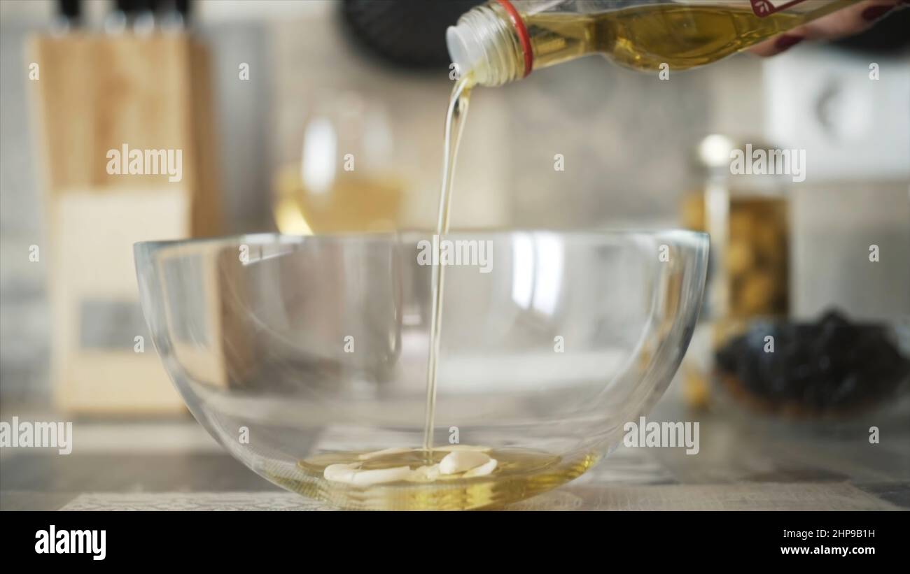 Chef adding oil pan slow hi-res stock photography and images - Alamy