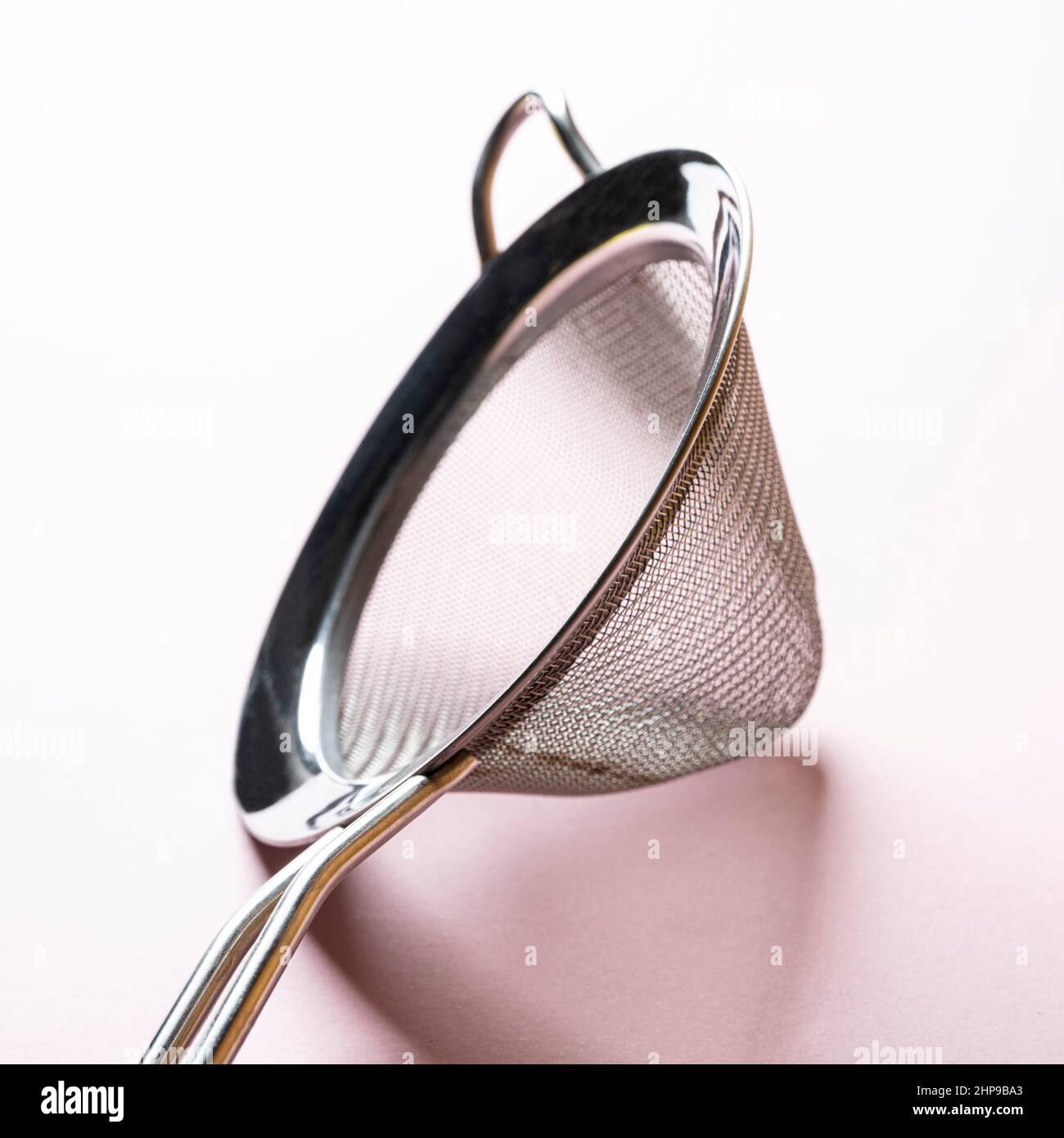 the wire mesh of a colander in the kitchen Stock Photo - Alamy
