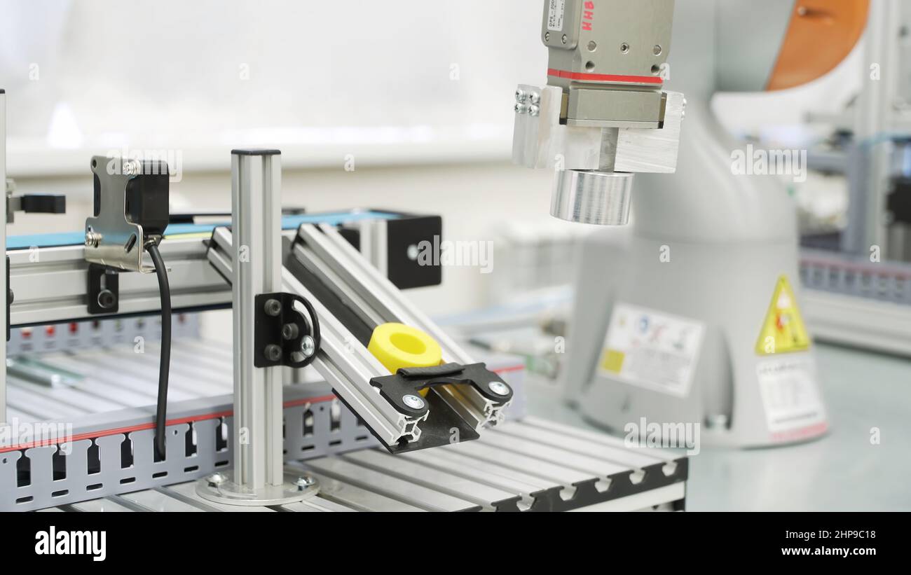 Close up of yellow object created by 3D printer in modern workshop ...