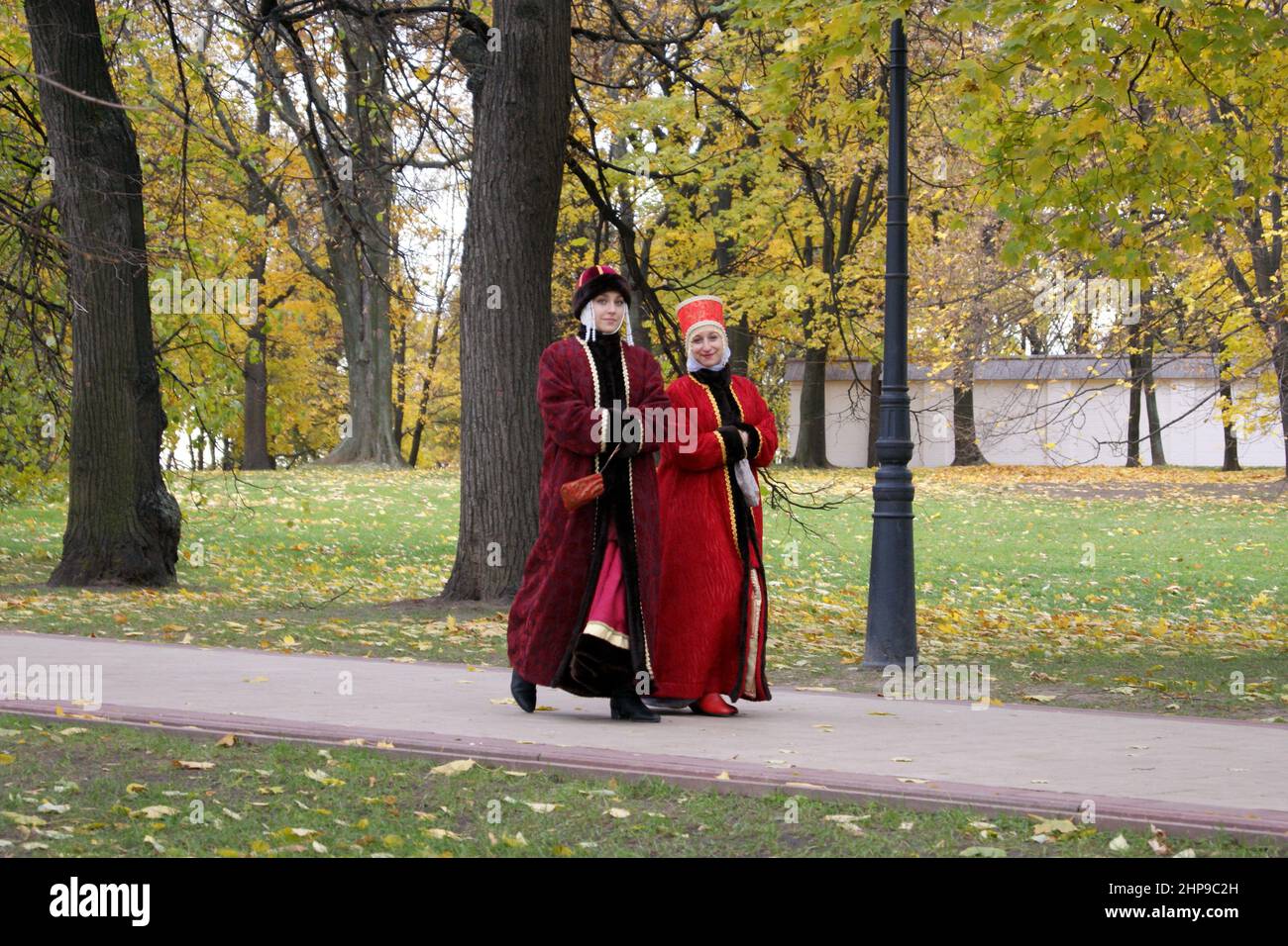 Female guides, wearing ornate traditional Russian garments, walking in ...
