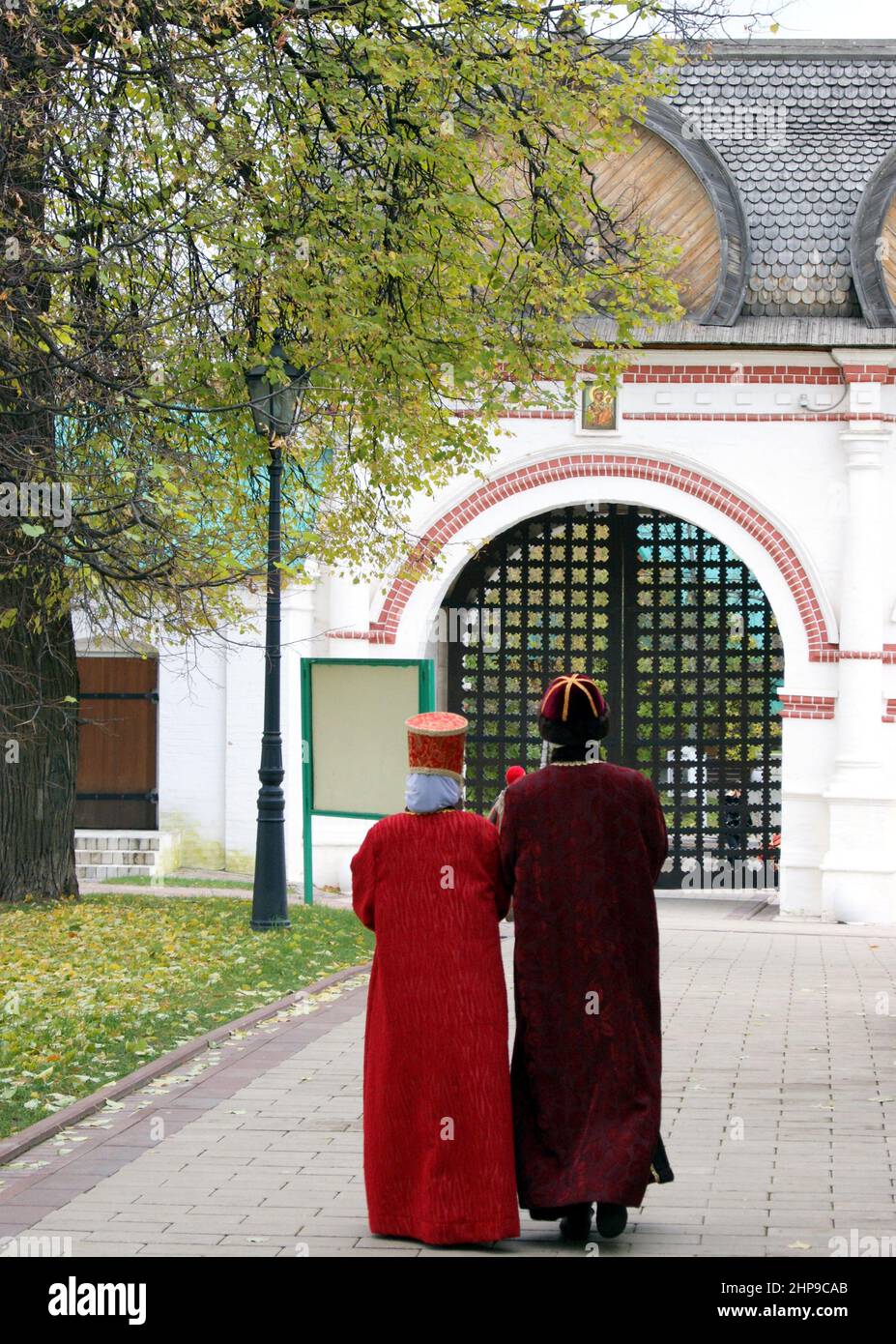 Female guides, wearing ornate traditional Russian garments, walking in ...