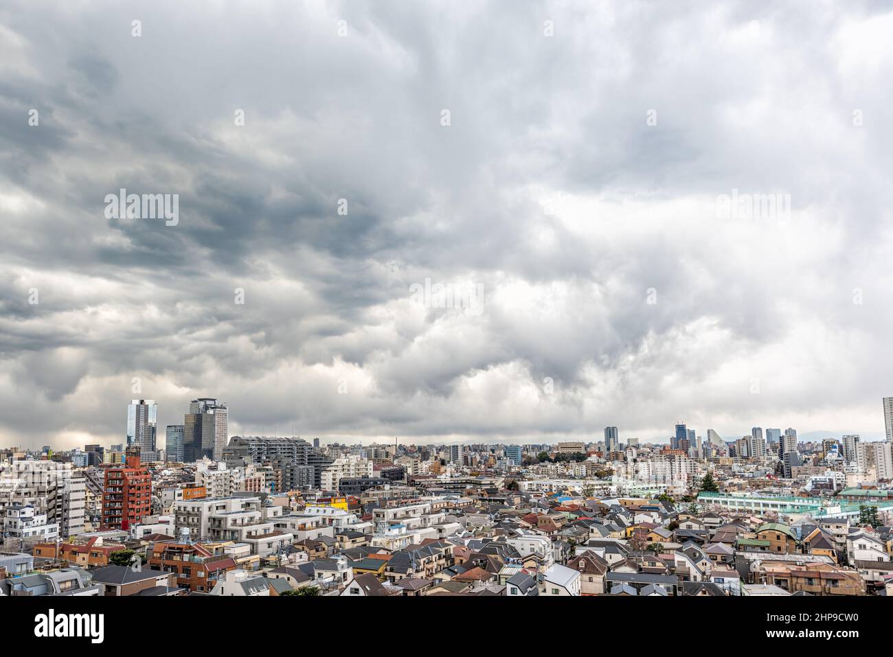 Shinjuku, Tokyo ward area dark gloomy stormy sky cityscape aerial above ...