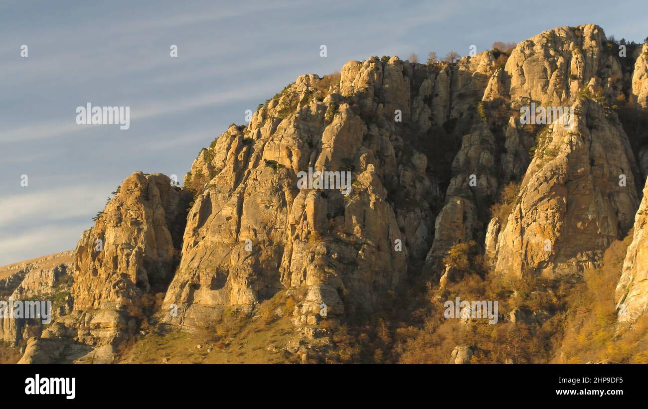 Flying aerial view on Beautiful and huge mountain rock at sunset. Shot ...