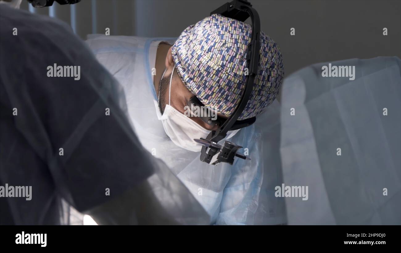 The medical surgeons team in the hospital performing surgical operation ...