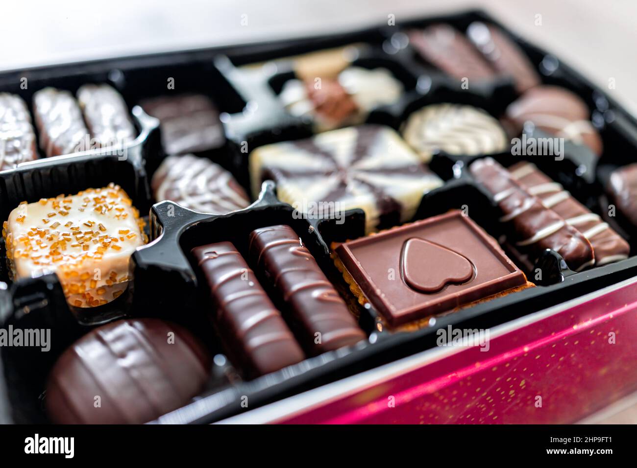 European chocolate cookies box side view closeup with truffles gourmet ...