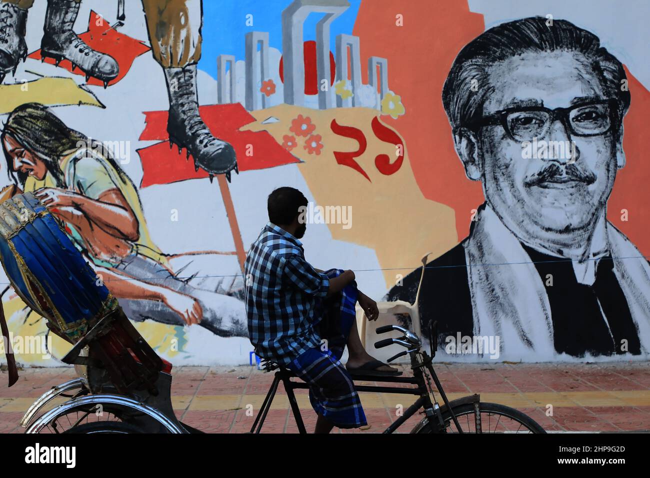 Dhaka, Bangladesh. 19th Feb, 2022. A Rickshaw Puller rides past a ...