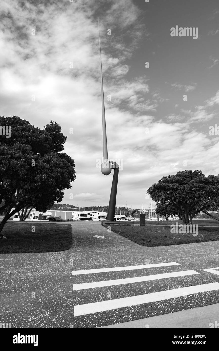 Beautiful grayscale of waking zebra track with trees and a cloudy sky ...